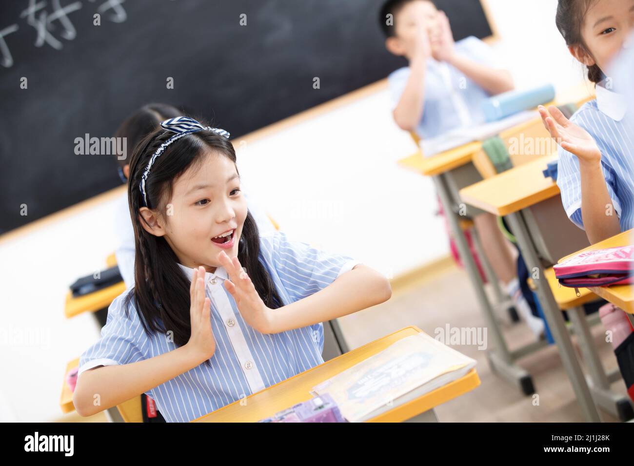 Elementary school students in the classroom Stock Photo - Alamy