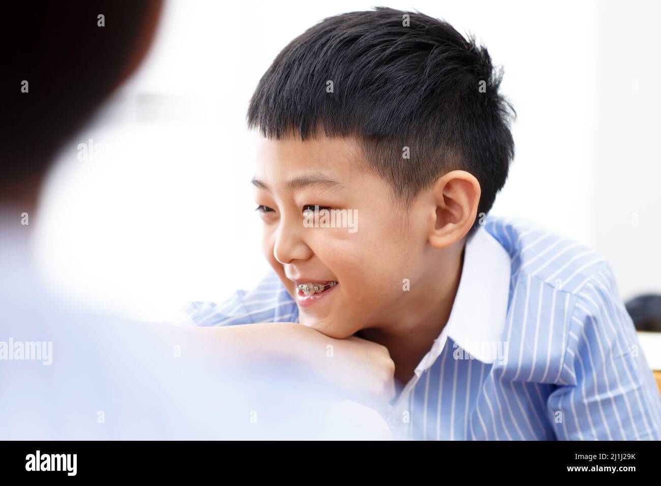 Primary school boy in the classroom Stock Photo - Alamy