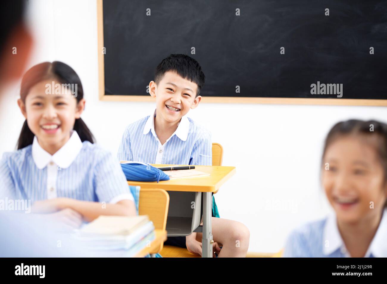 Elementary school students in the classroom Stock Photo - Alamy
