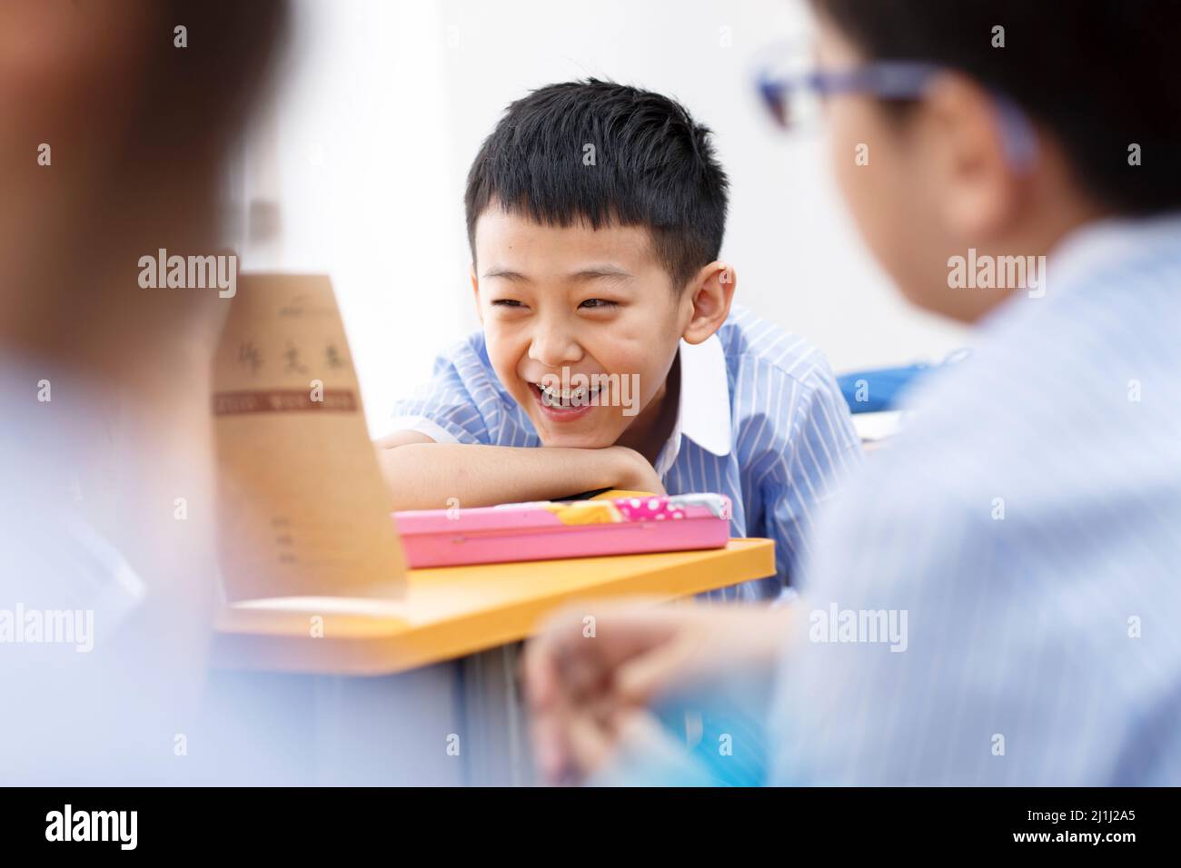 Primary school boy in the classroom Stock Photo - Alamy
