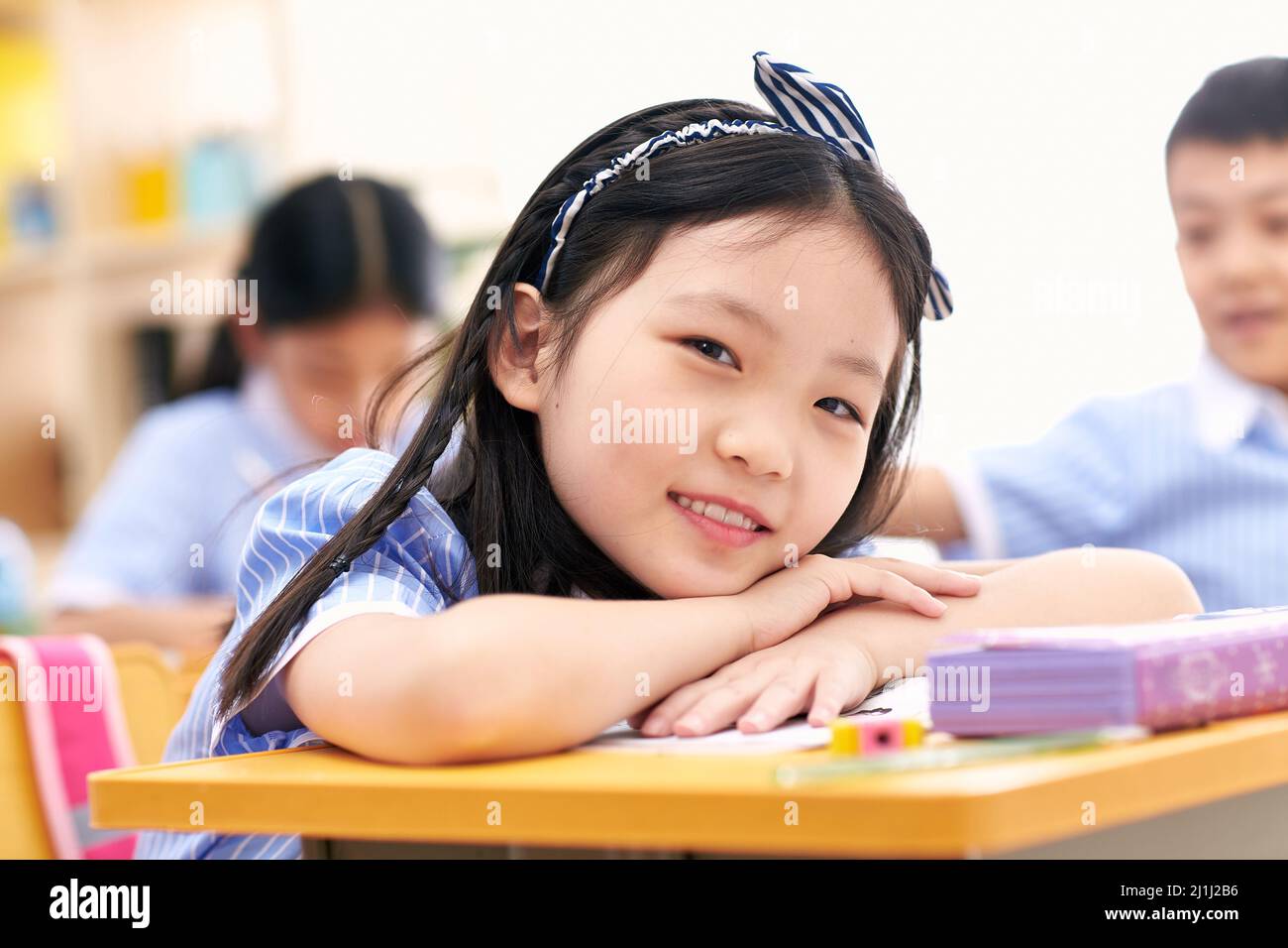 Primary school girls in the classroom Stock Photo - Alamy