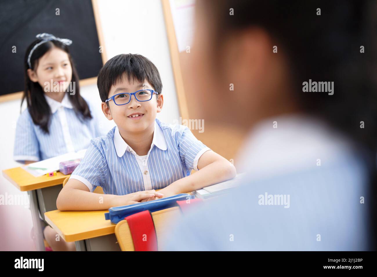 Elementary school students in the classroom Stock Photo - Alamy