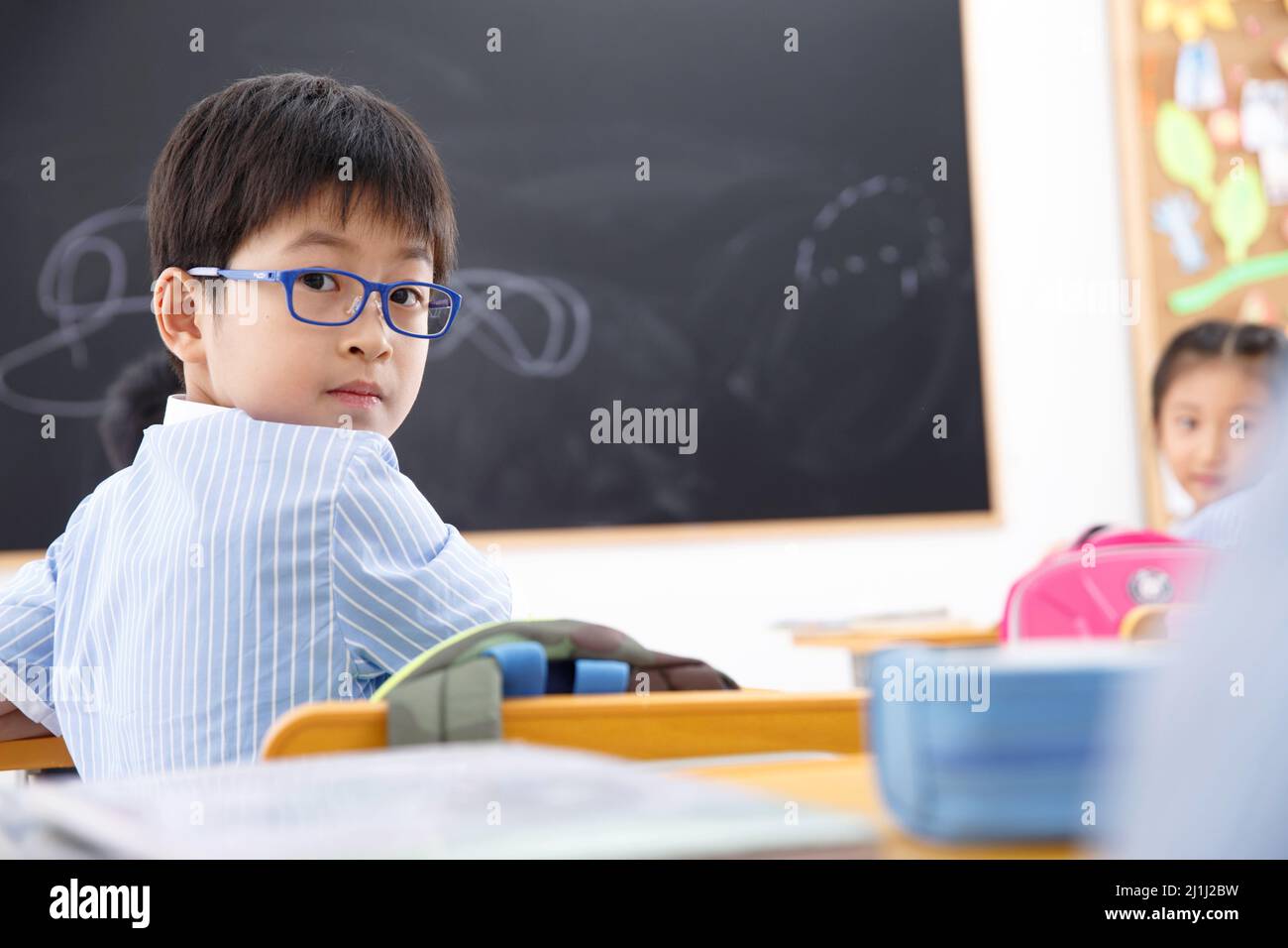Primary school boy in the classroom Stock Photo - Alamy