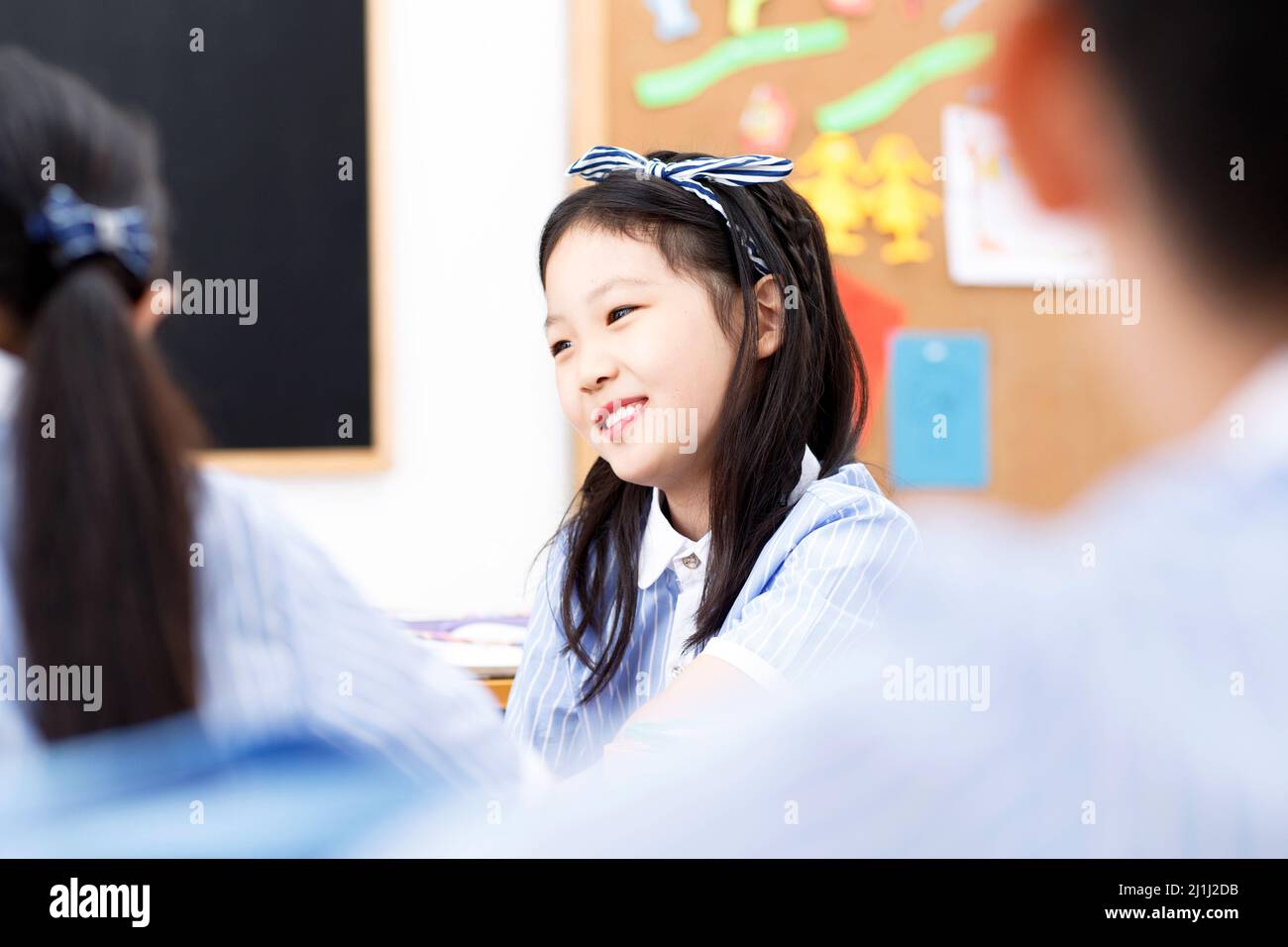 Elementary school students in the classroom Stock Photo - Alamy