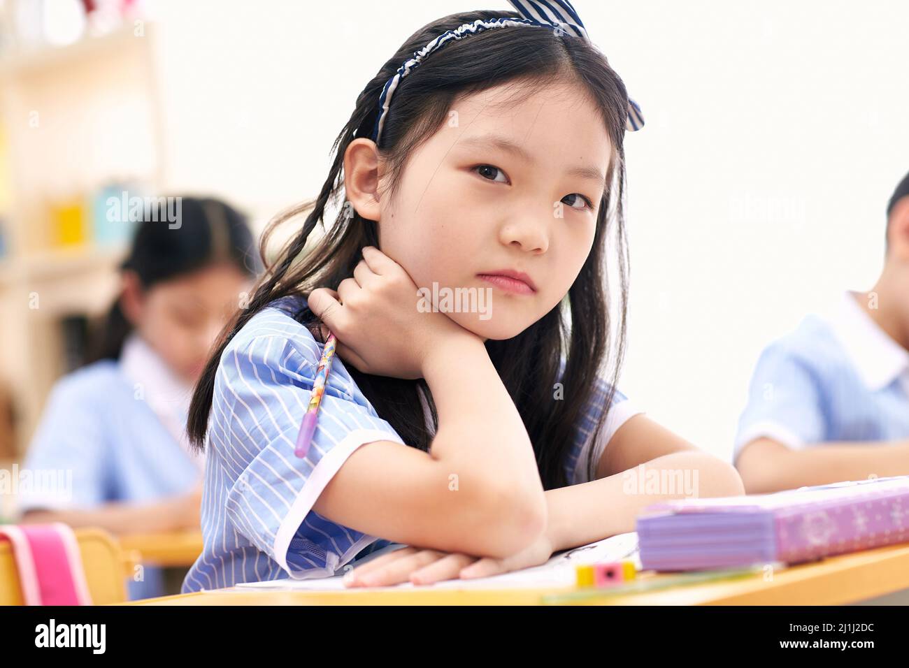 Primary school girls in the classroom Stock Photo - Alamy