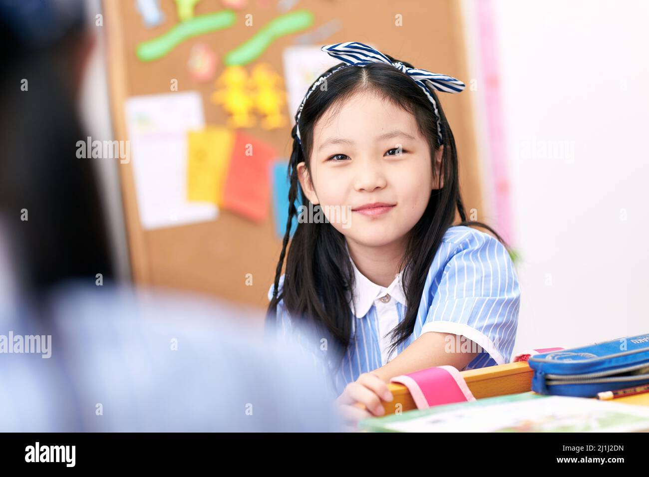 Primary school girls in the classroom Stock Photo - Alamy