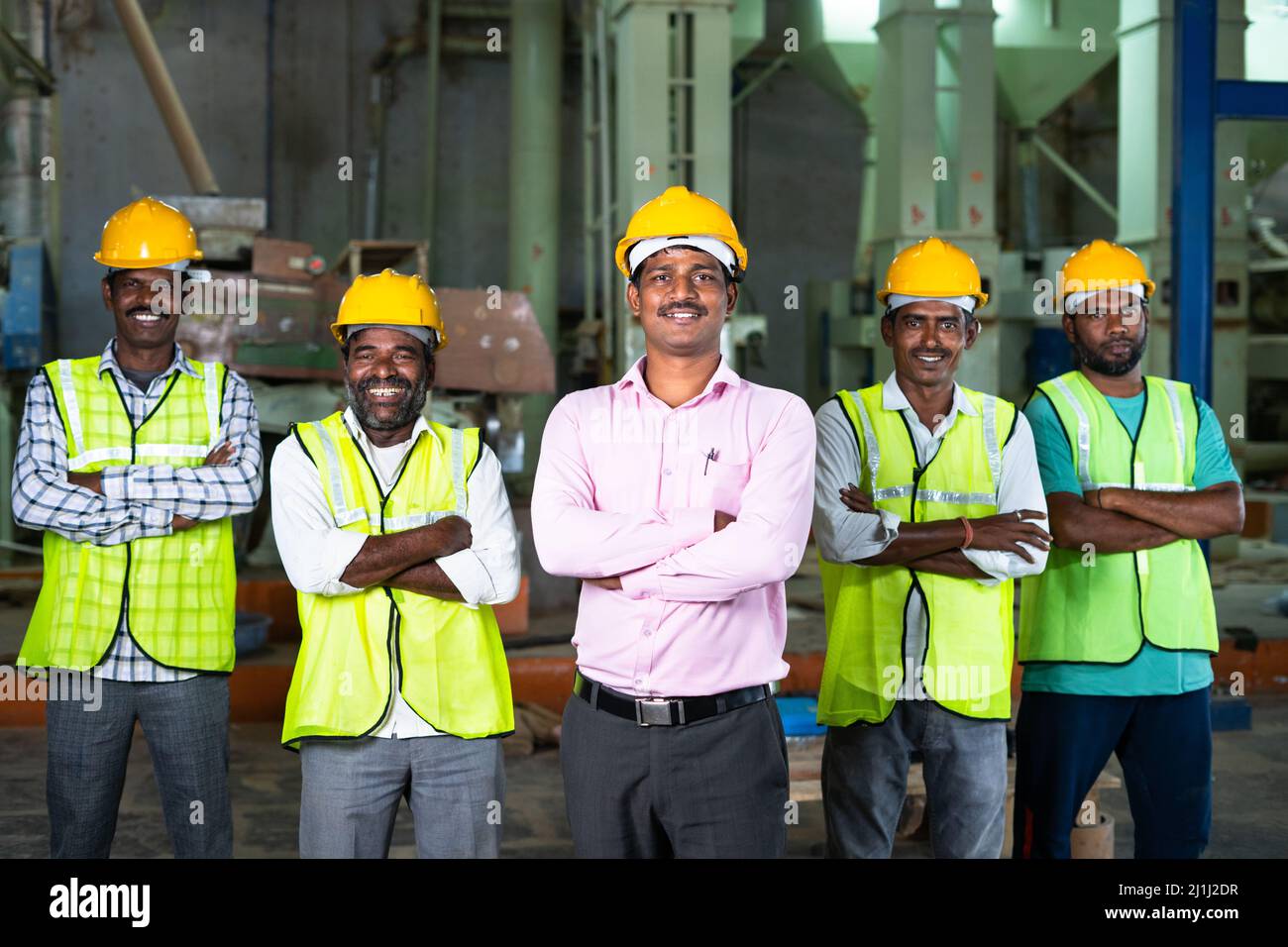 industrial employees with crossed arms standing by looking camera at ...