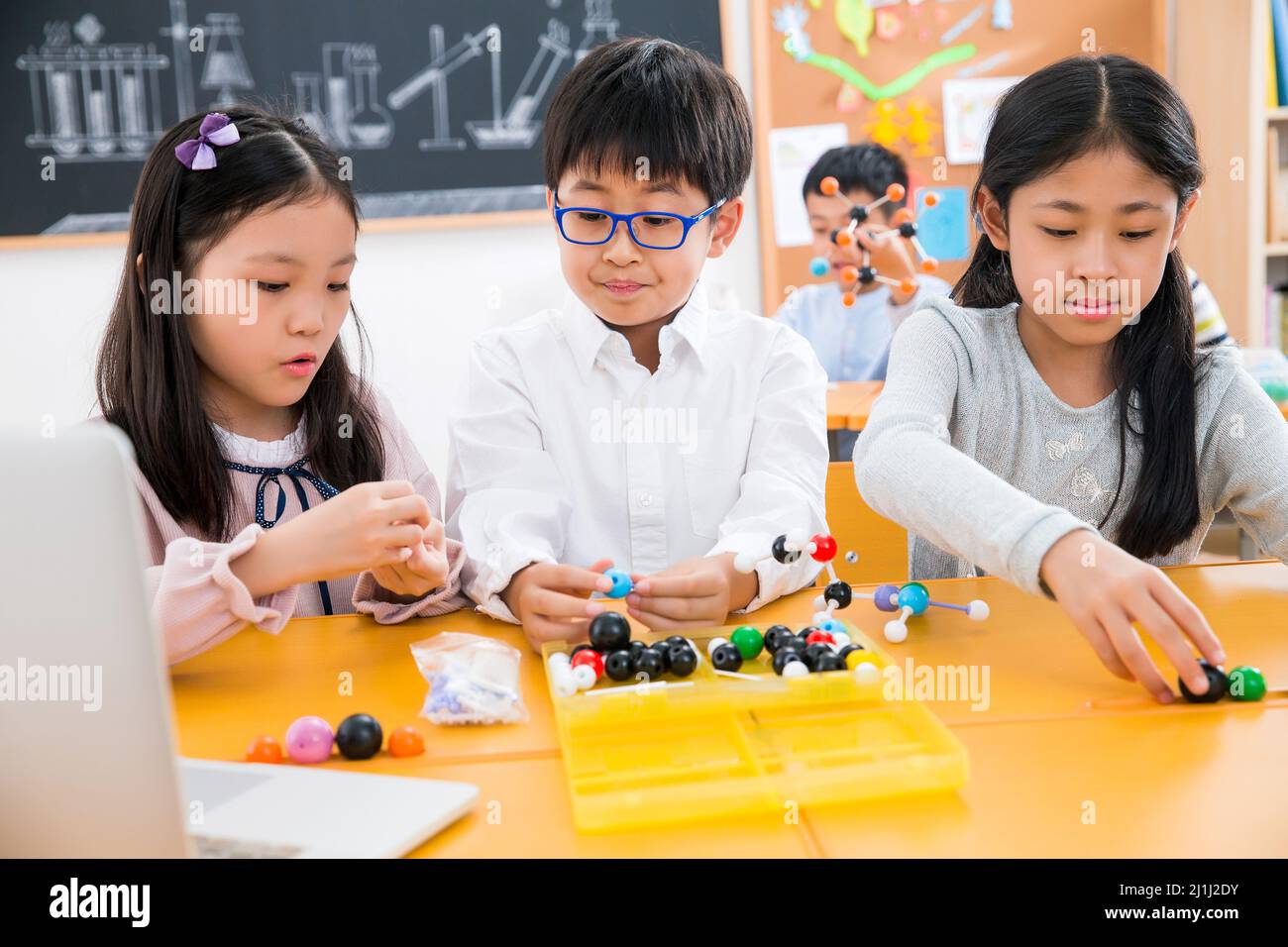 Elementary school students use computers in the classroom Stock Photo ...