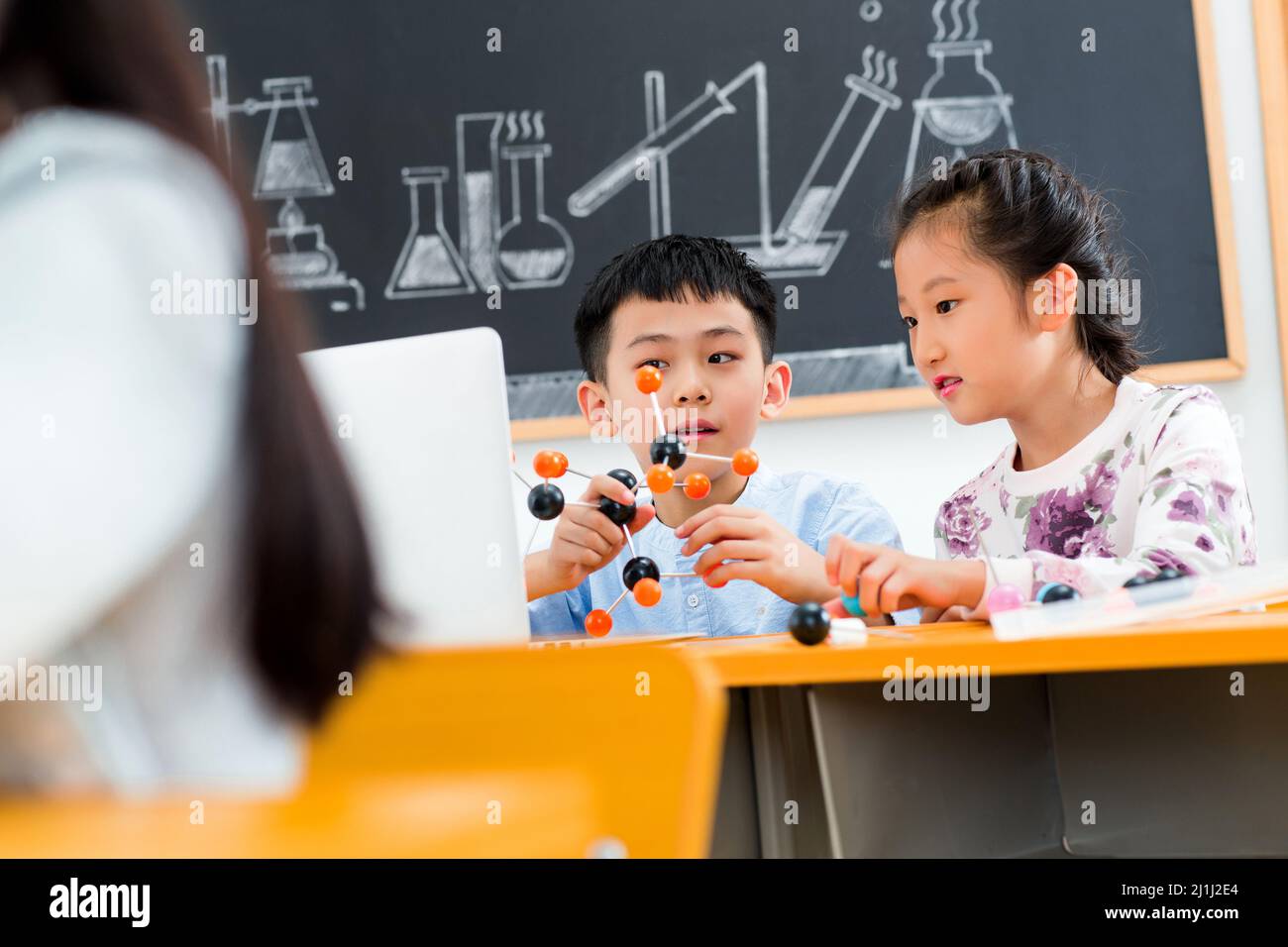 Elementary school students use computers in the classroom Stock Photo ...