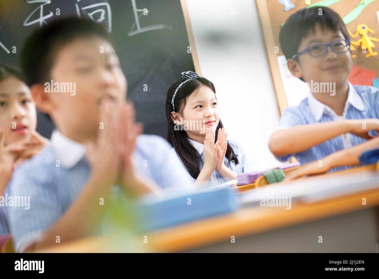 Elementary school students in the classroom Stock Photo - Alamy