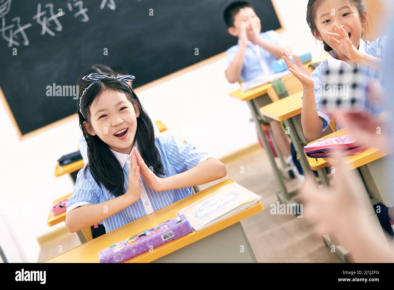 Elementary school students in the classroom Stock Photo - Alamy
