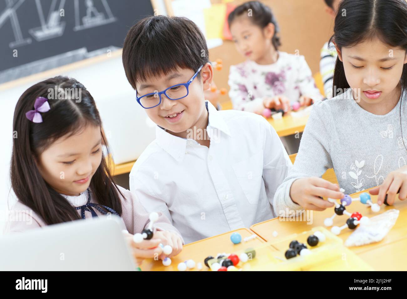 Elementary school students use computers in the classroom Stock Photo ...