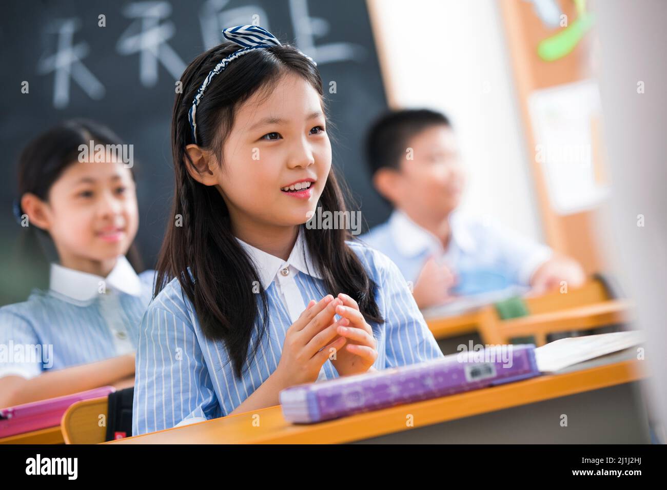 Elementary school students in the classroom Stock Photo - Alamy