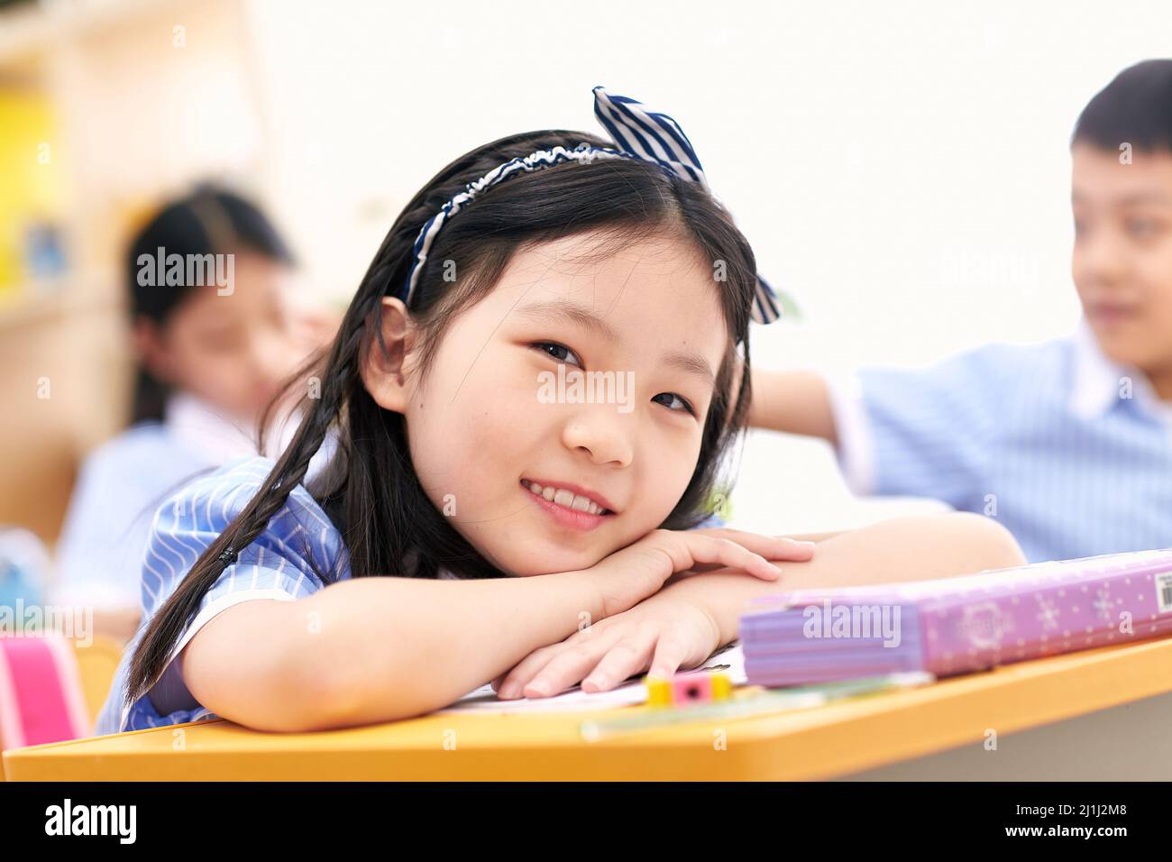 Primary school girls in the classroom Stock Photo - Alamy