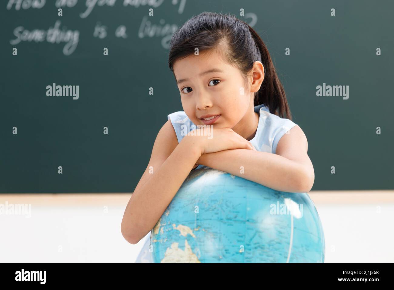 Primary school girls in the classroom Stock Photo - Alamy