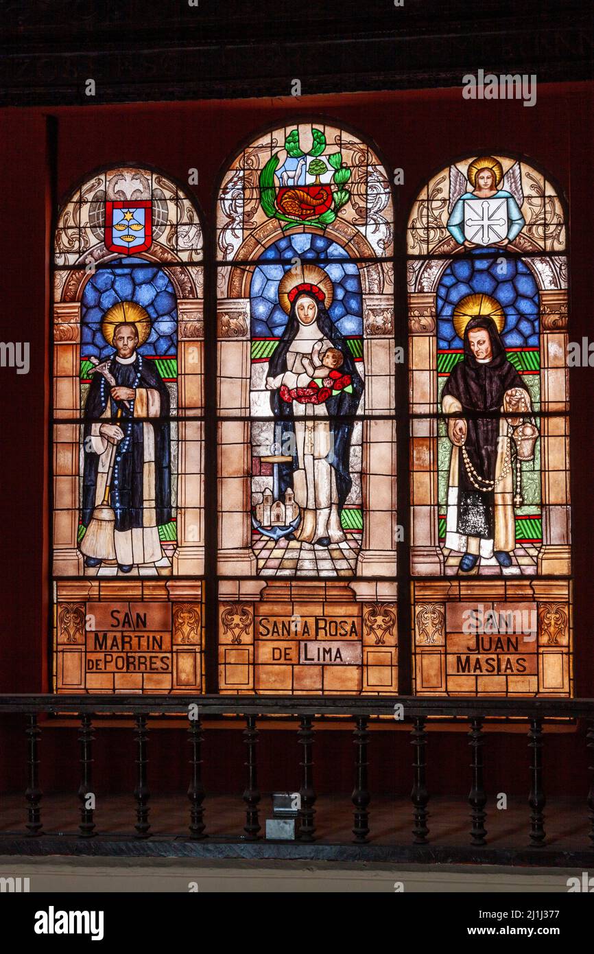 A vertical shot of a religious glass window inside Santo Domingo ...