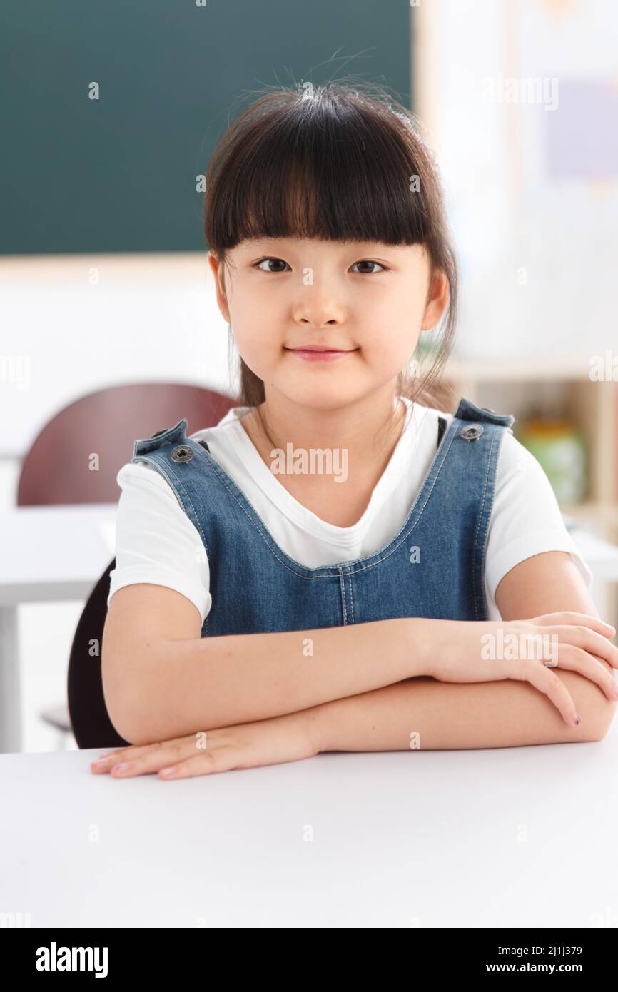 Primary school girls in the classroom Stock Photo - Alamy