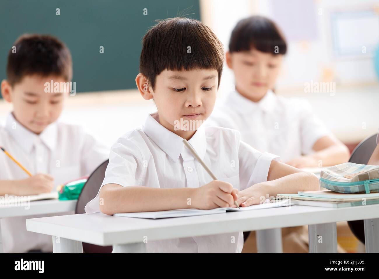 Pupils are learning in the classroom Stock Photo - Alamy