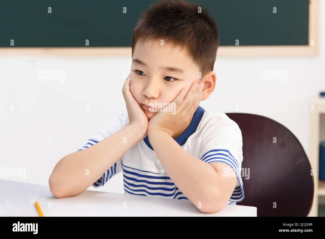 Primary school boys in the classroom Stock Photo - Alamy