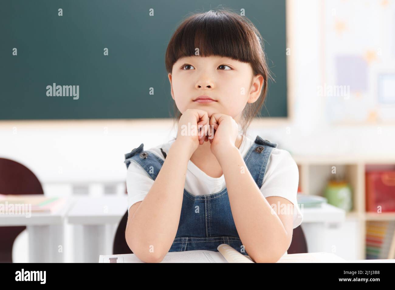 Primary school girls in the classroom Stock Photo - Alamy