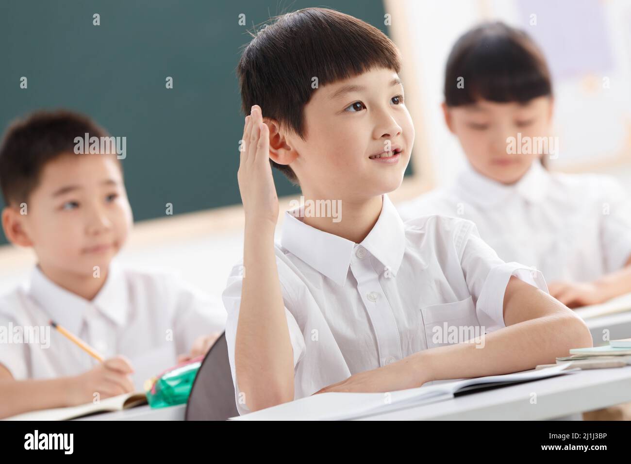 Pupils studying in school uniform hi-res stock photography and images ...