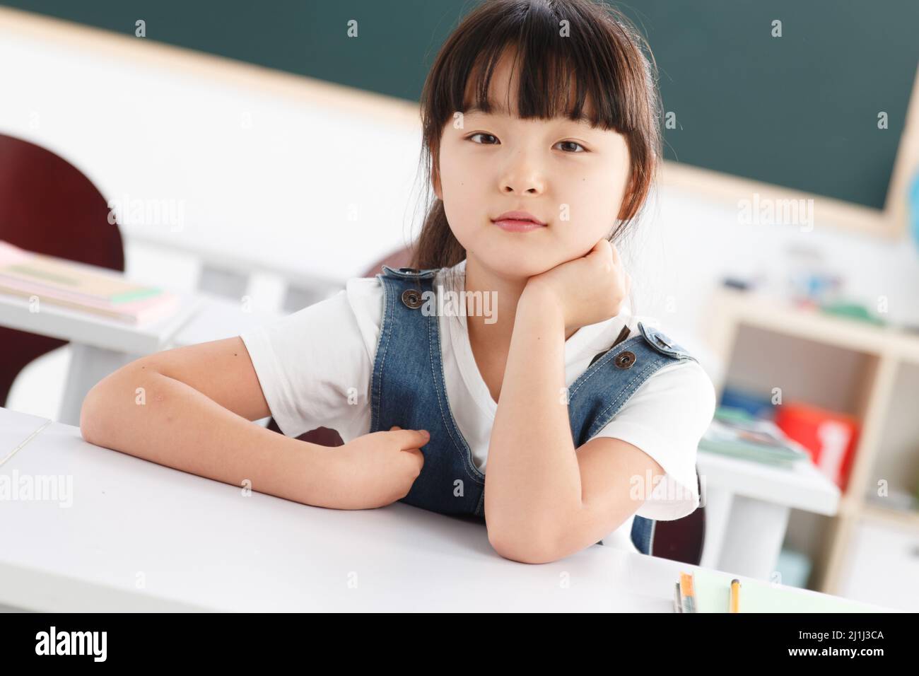 Primary school girls in the classroom Stock Photo - Alamy