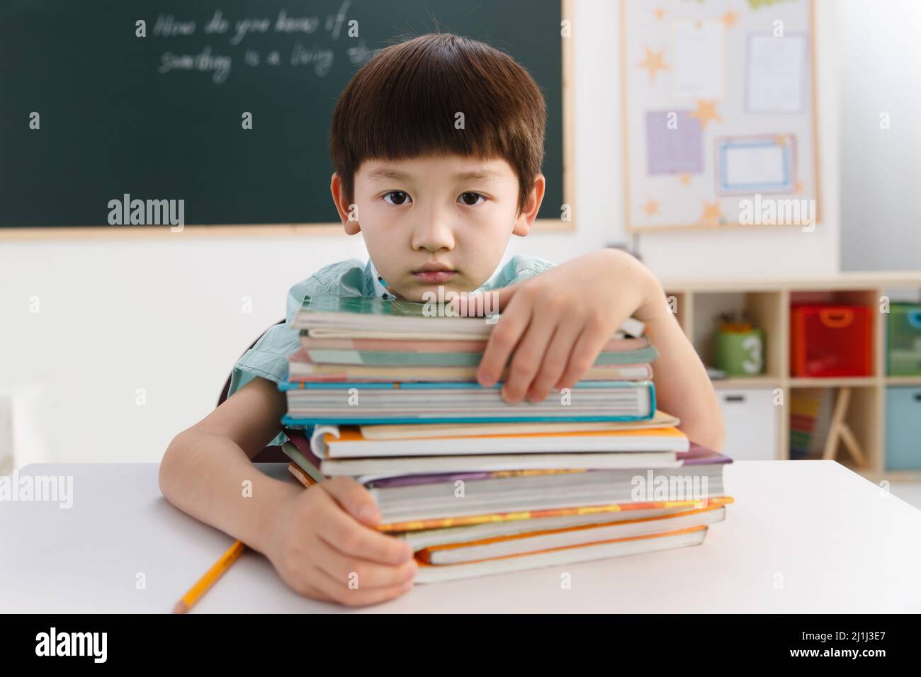 Primary school students on the book Stock Photo - Alamy