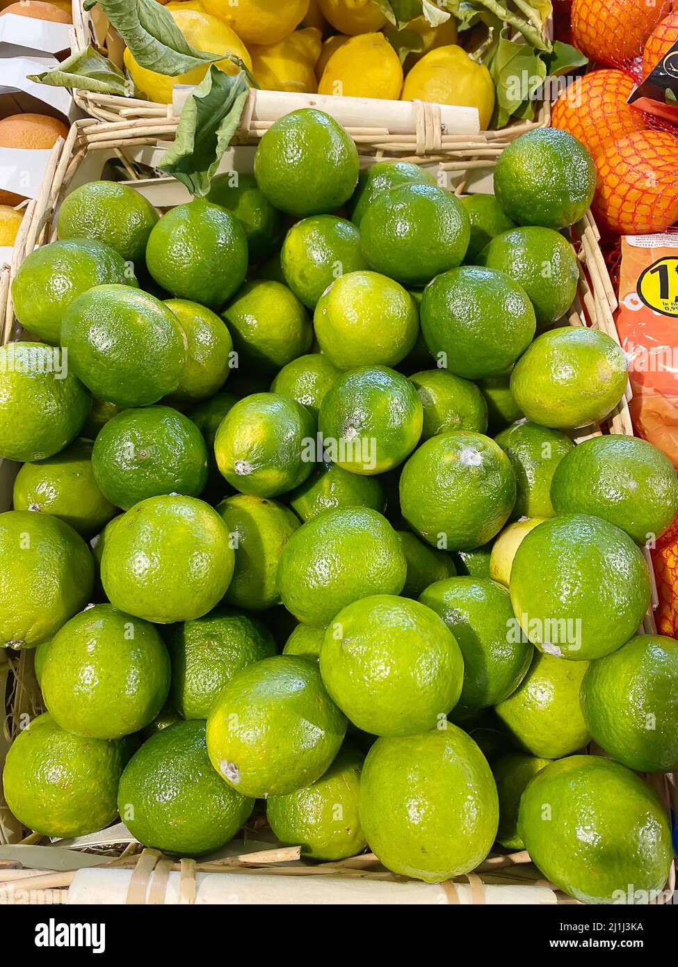 Lots of food on the counter in the supermarket. Vegetables, fruits ...