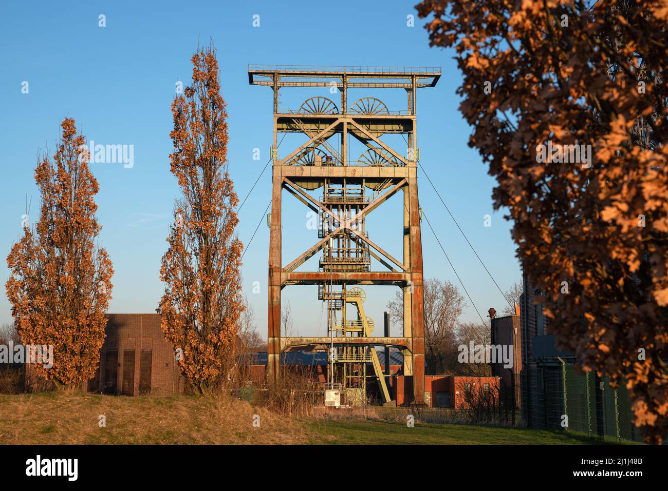 Headframe of old cold mine against sky, industrial heritage of Ruhr ...