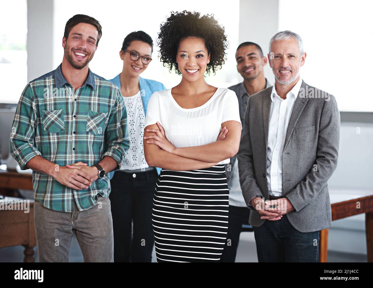 Ready for any challenge. Portrait of a group of smiling coworkers ...