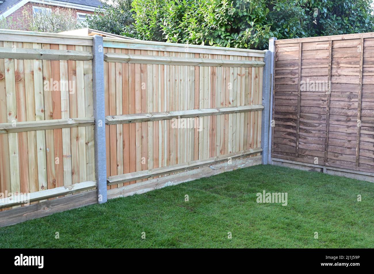 Different types of fences in an English garden in spring Stock Photo ...