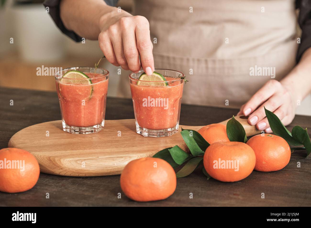 Adding fruit slice cocktail close hi-res stock photography and images ...