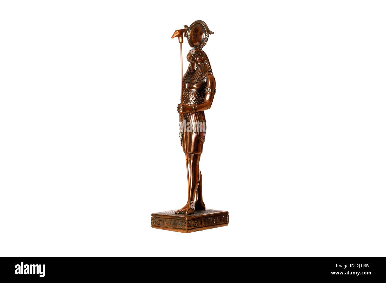 golden figurine of the god Ra with the head of a falcon isolated on a ...