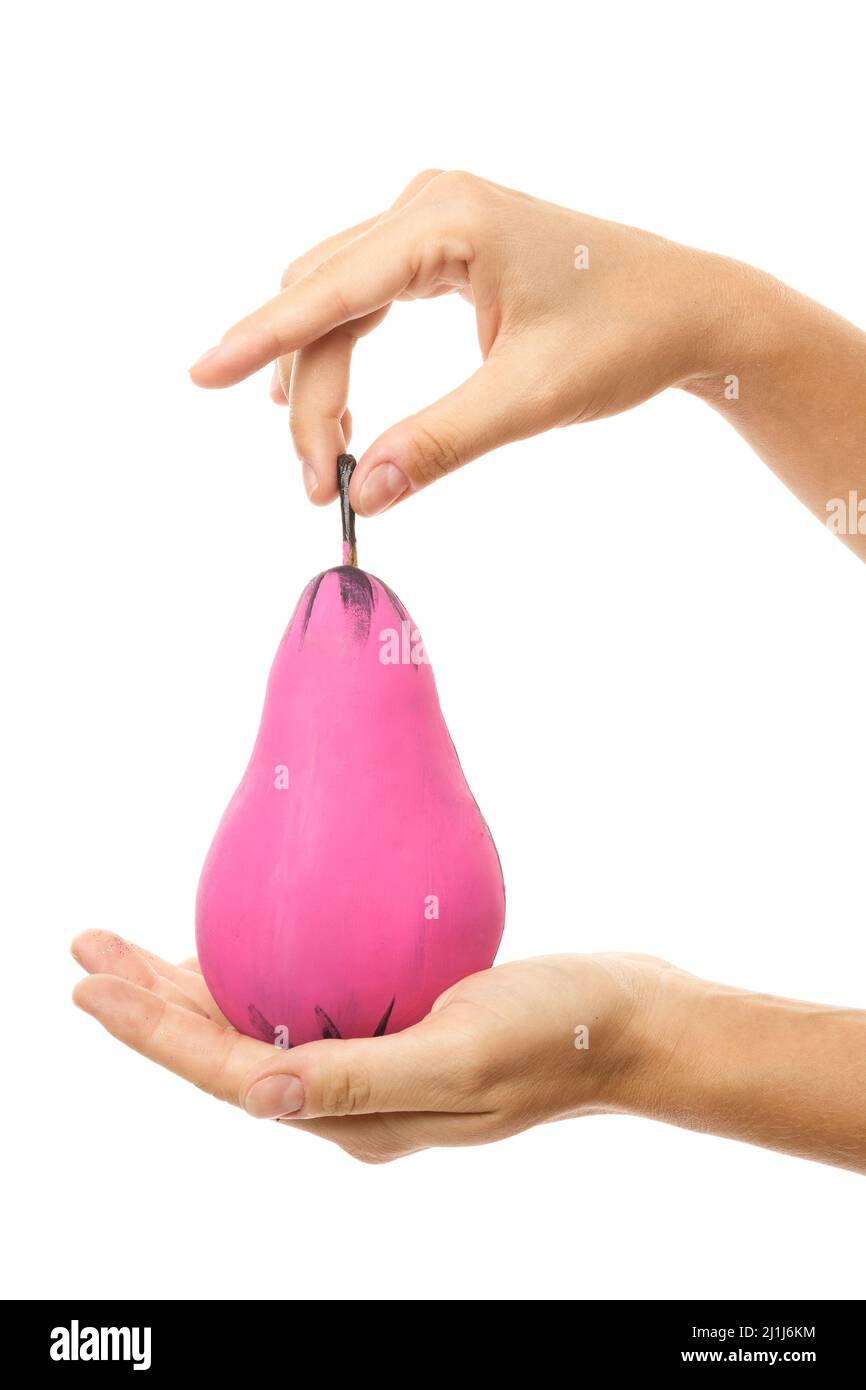 Female hand and creatively decorated pink pear Stock Photo - Alamy
