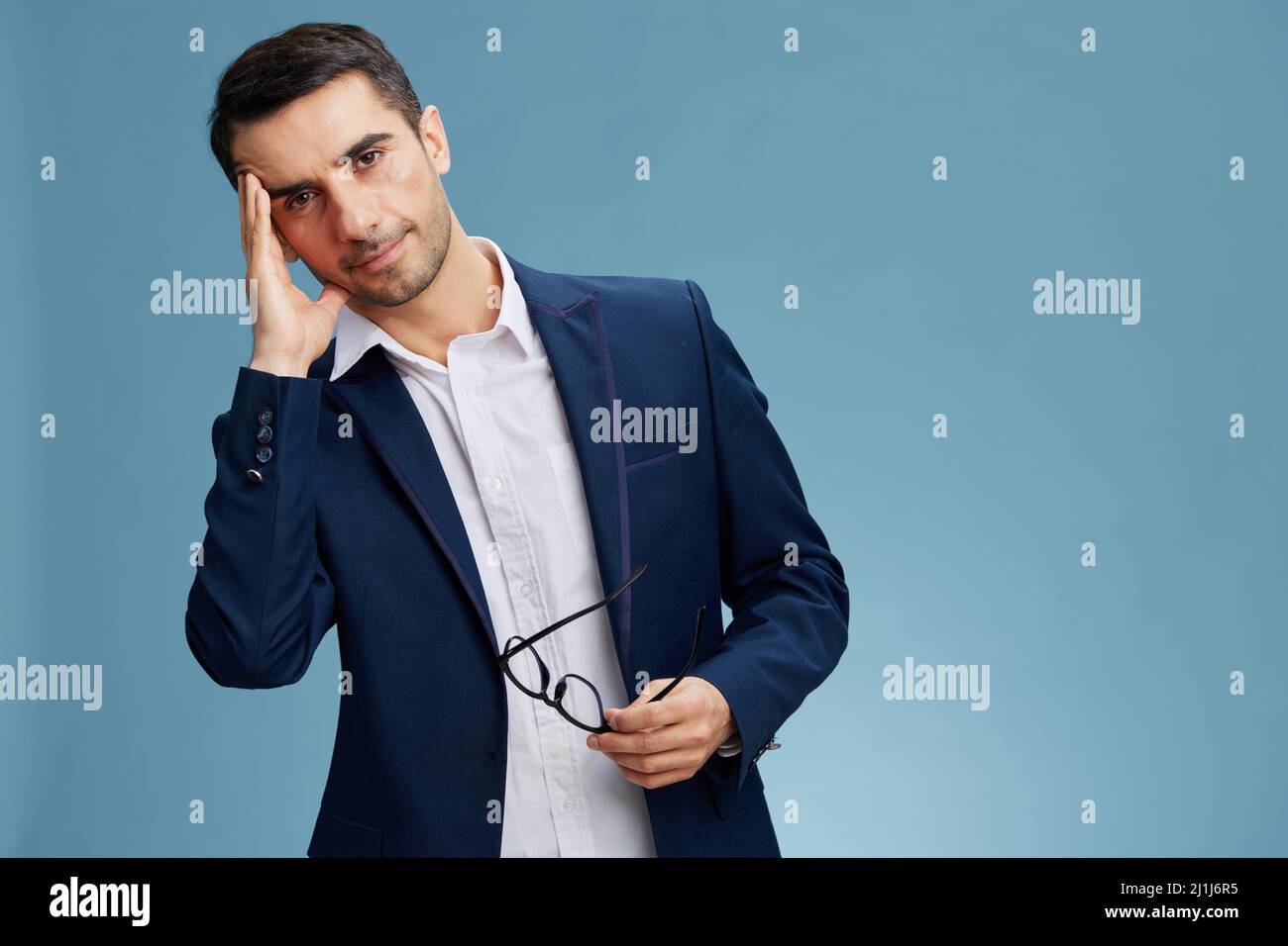 businessman portrait holding on to the head fatigue with glasses blue ...