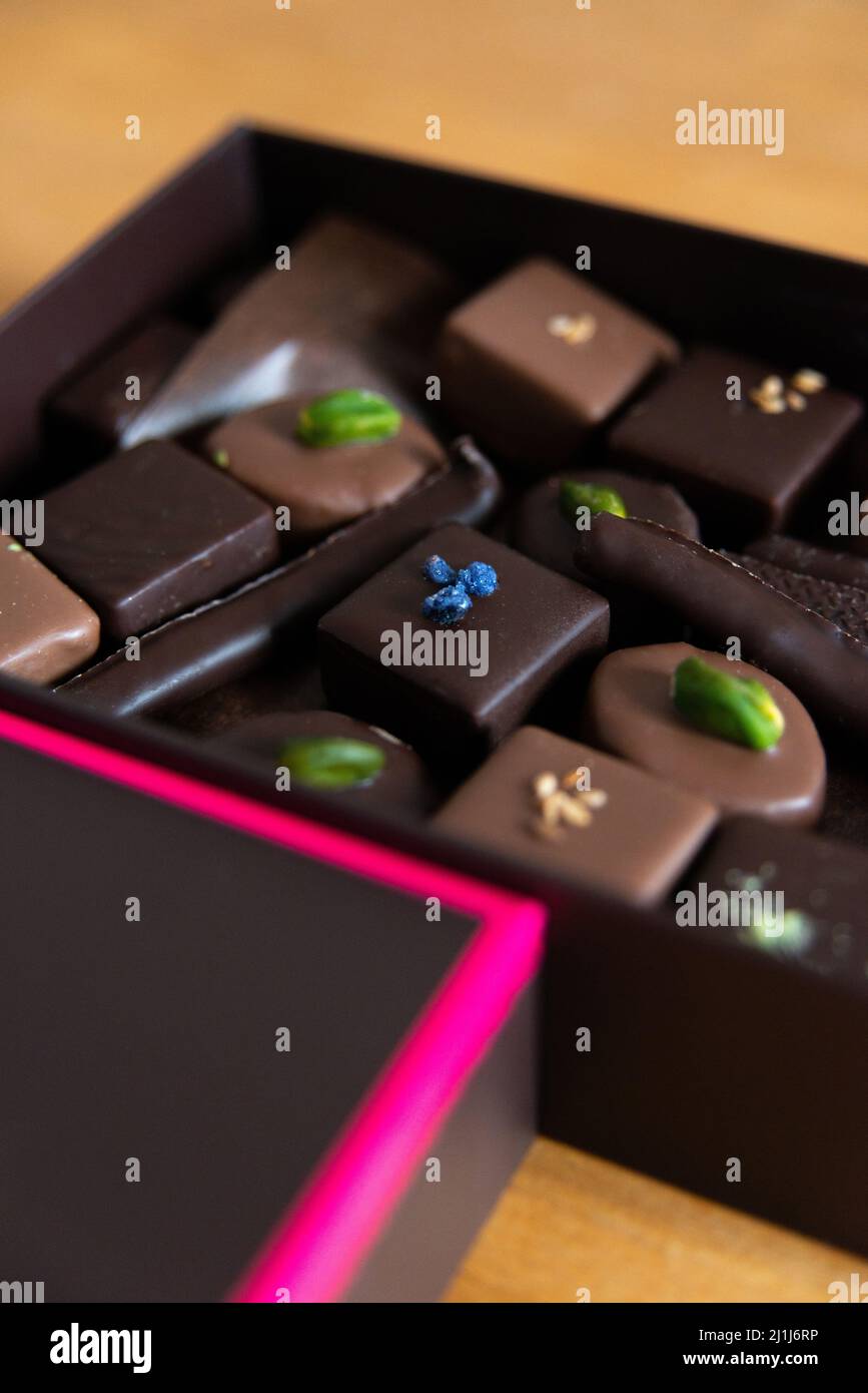 Vertical view of a close-up of a full open chocolate box Stock Photo ...