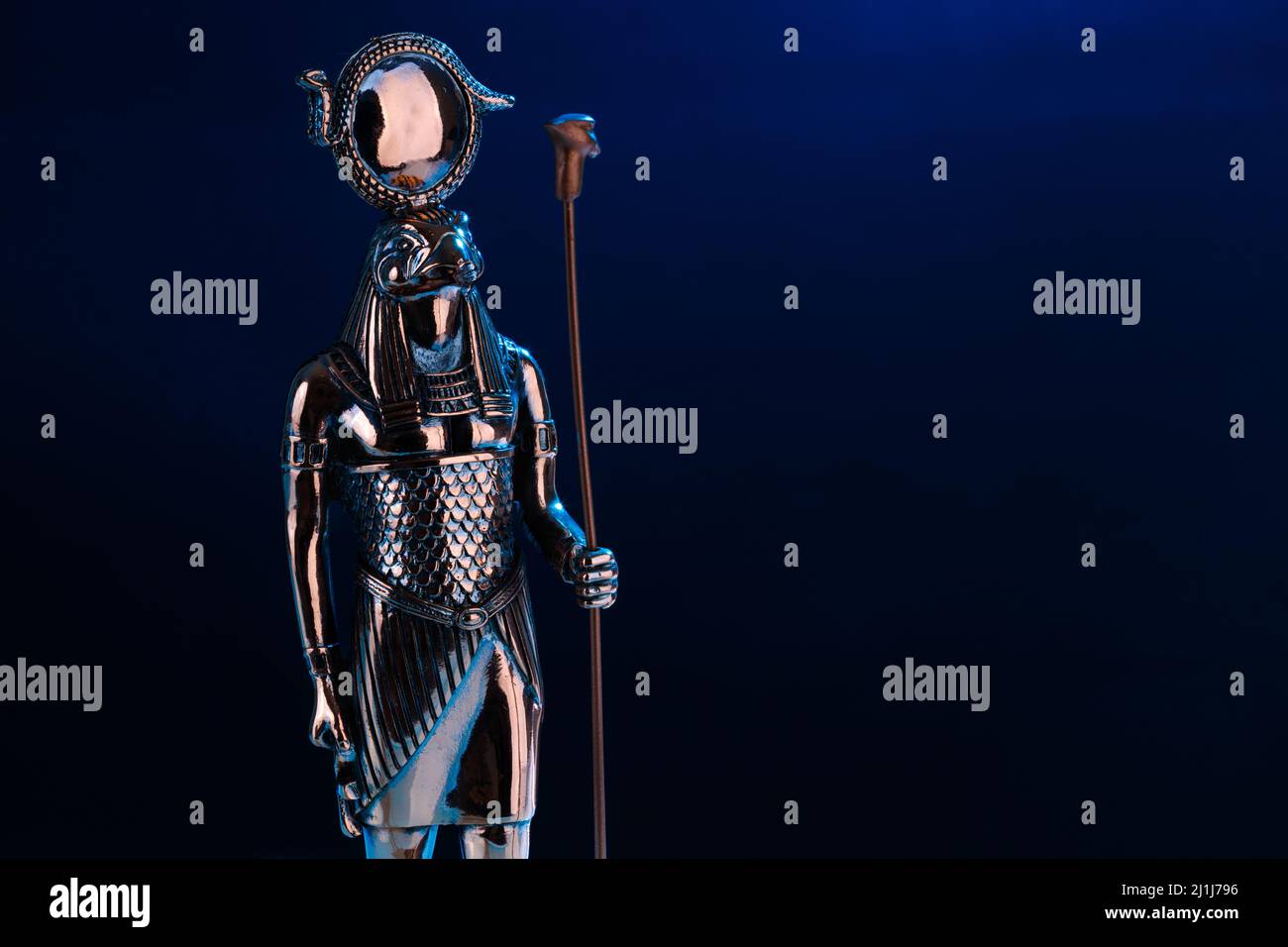 metal statue of the Egyptian god Ra with the head of a falcon on a ...