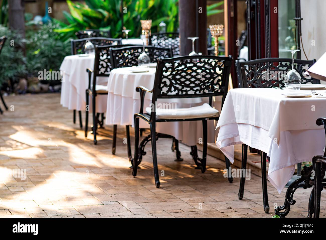 small street restaurant awaits visitors, outdoor tables set Stock Photo ...