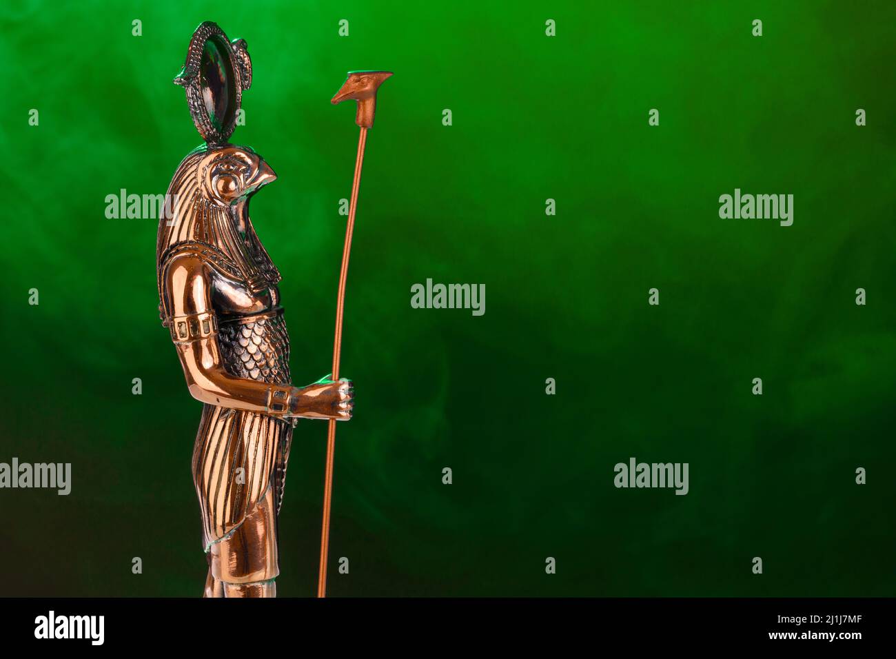 golden statue of the Egyptian god Ra with the head of a falcon on a ...