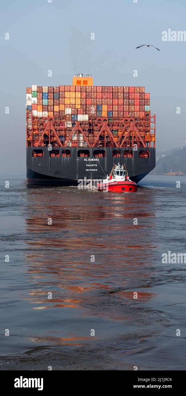 Hamburg, Germany. 25th Mar, 2022. The container ship Al Zubara is towed ...