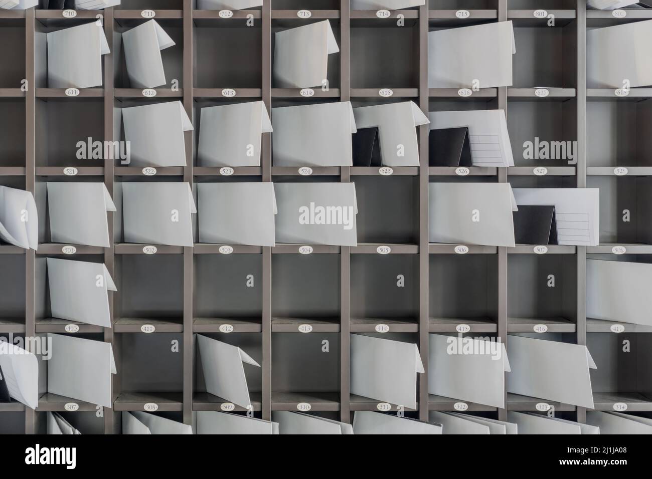 Big stand with numbered sections with correspondence Stock Photo - Alamy