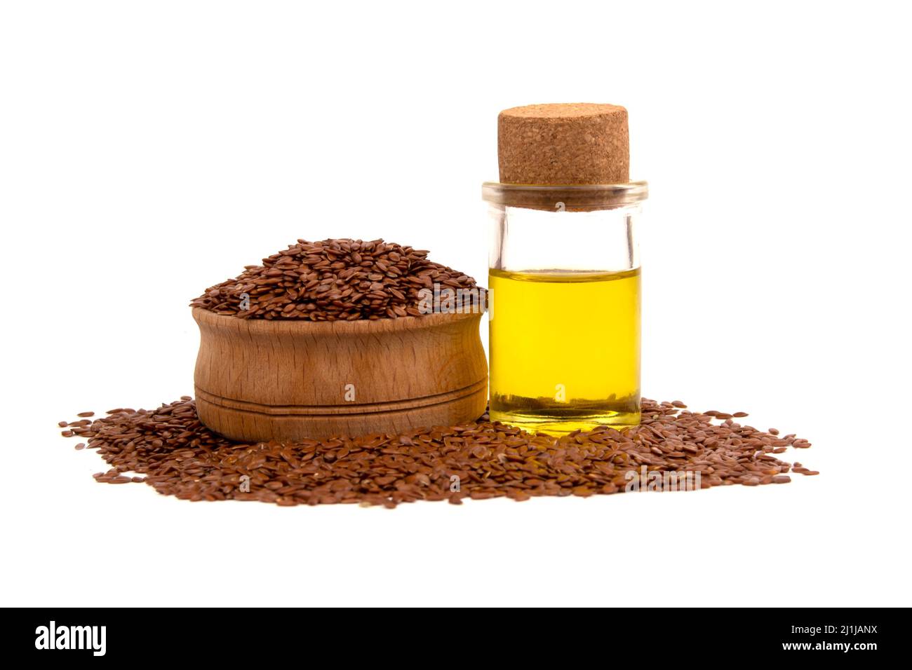 linseed oil with flax seeds in wooden bowl isolated on a white background Stock Photo - Alamy