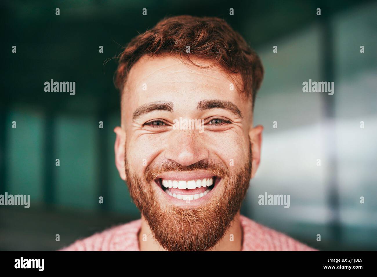 Young happy man smiling on camera outdoor - Focus on face Stock Photo ...