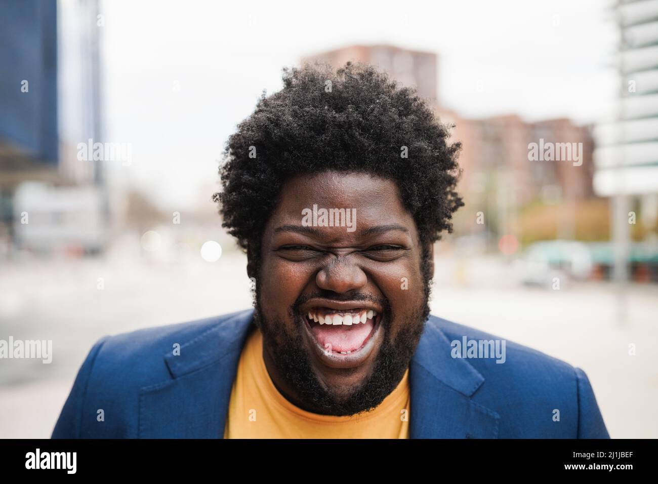 Happy african curvy man smiling on camera outdoor - Focus on face Stock ...