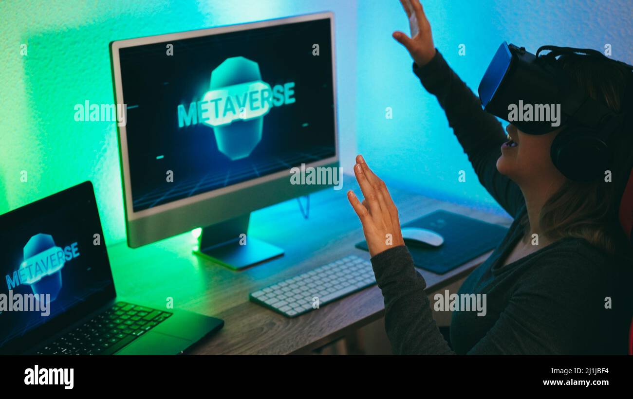 Girl using virtual reality futuristic headset - Metaverse technology ...