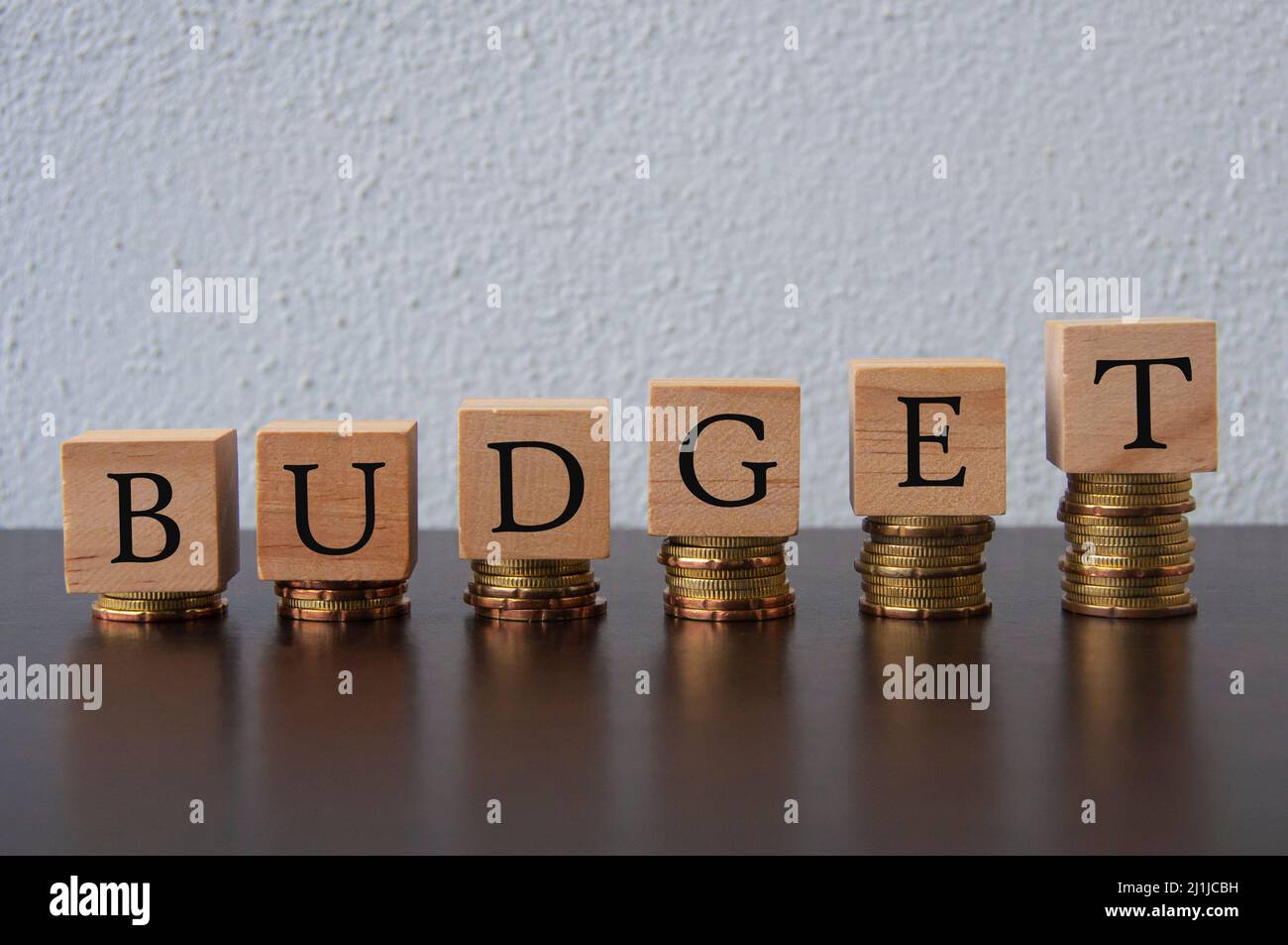 Coins Stack with Budget text on wooden blocks - Business and Financial ...