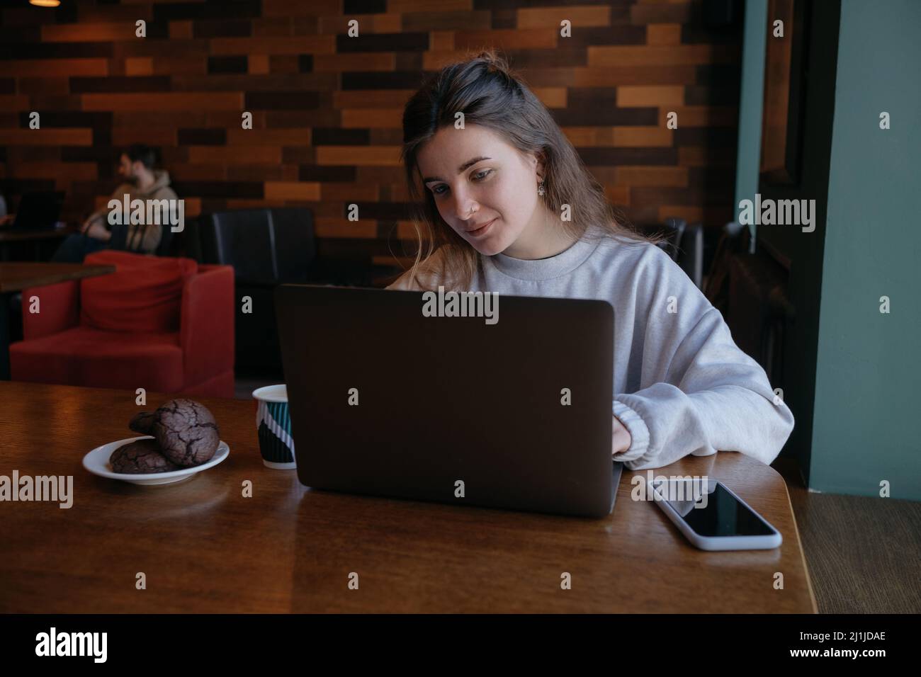 freelance woman happy working in a cafe remotely Stock Photo - Alamy