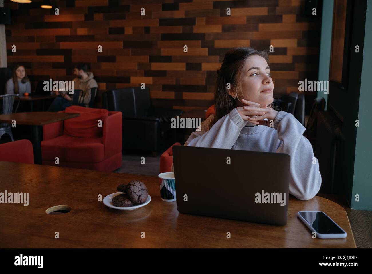 freelance woman happy working in a cafe remotely Stock Photo - Alamy