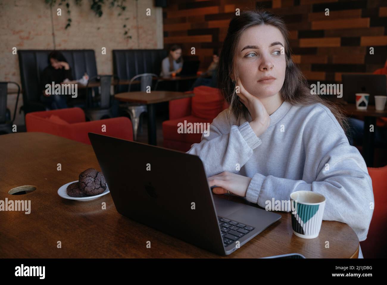 freelance woman happy working in a cafe remotely Stock Photo - Alamy