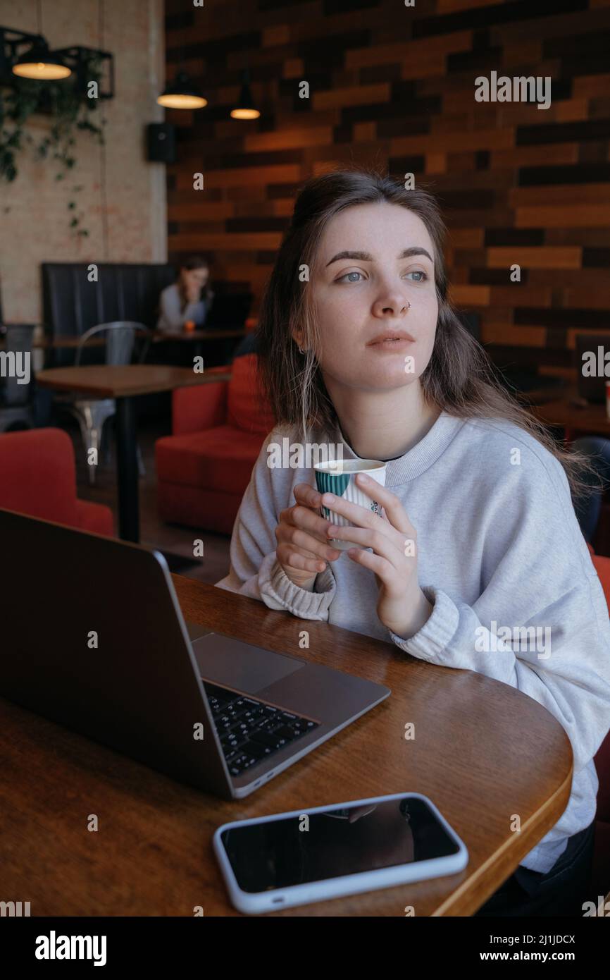 freelance woman happy working in a cafe remotely Stock Photo - Alamy